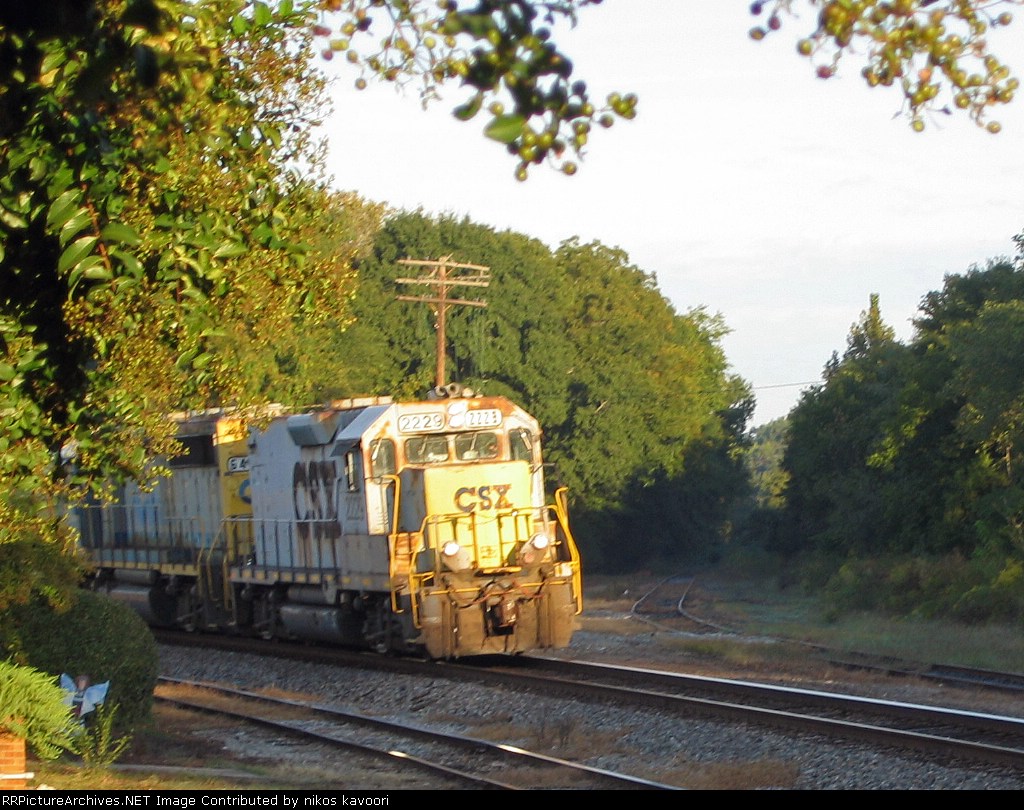 CSX 2229 leans into a curve passing through downtown Union Point